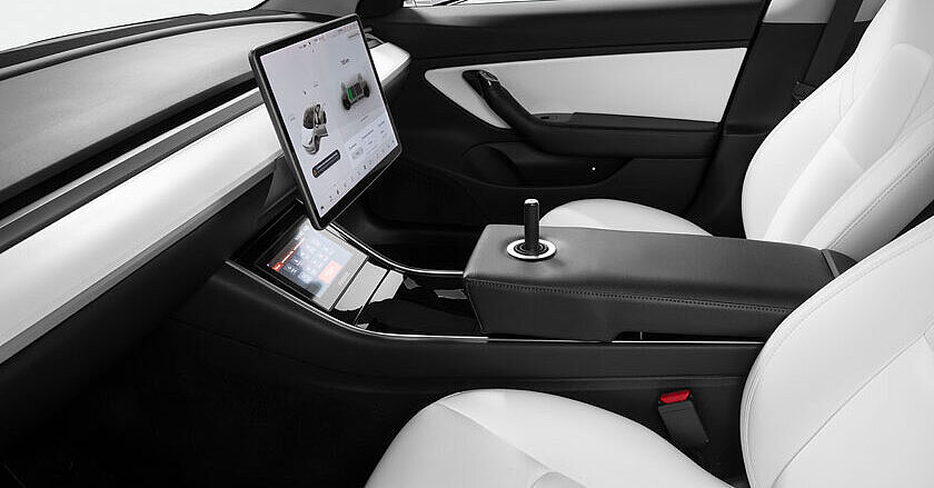 A Tesla Model 3 without steering wheel and pedals